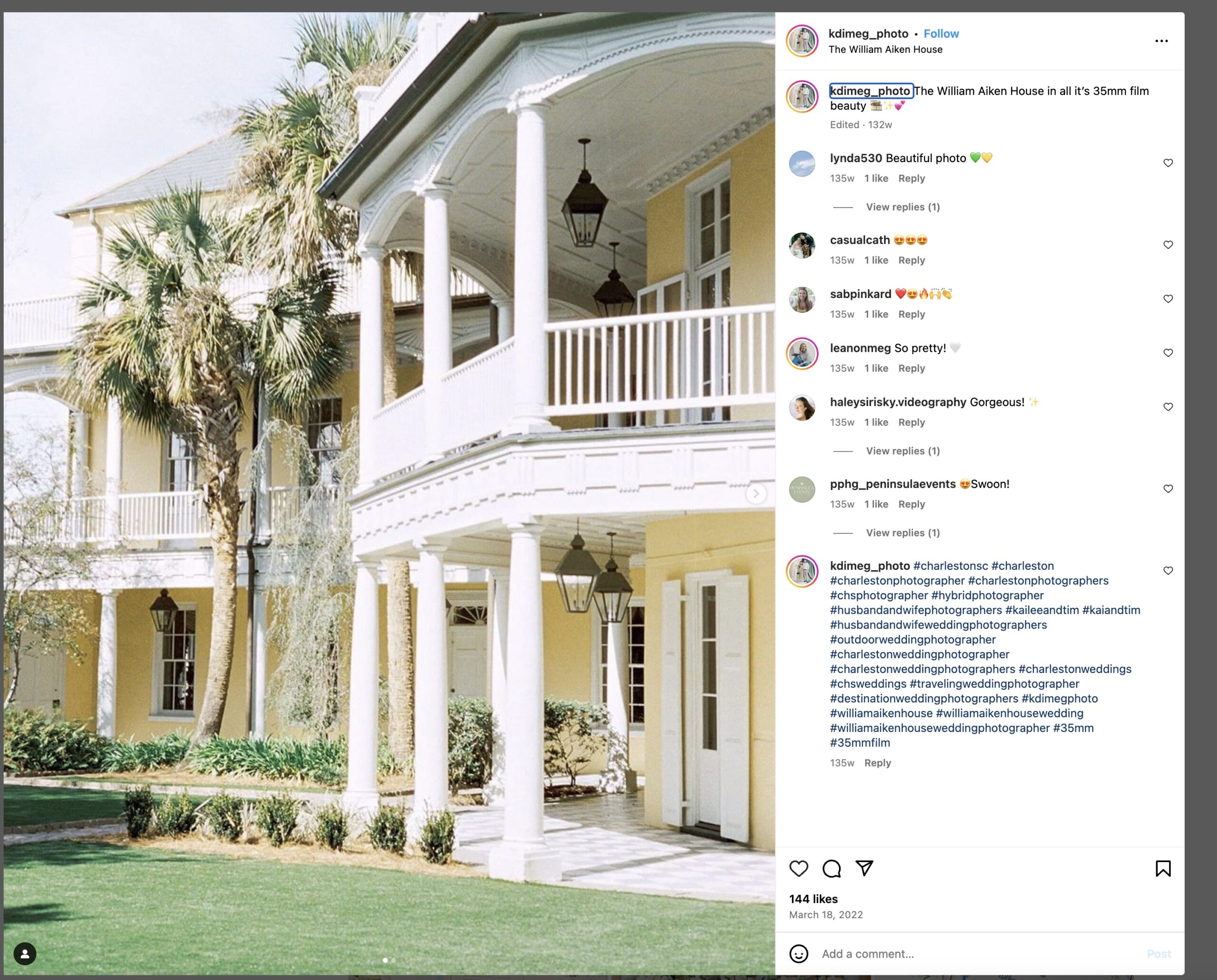 A two-story, pale yellow historic house with white columns, a veranda ...
