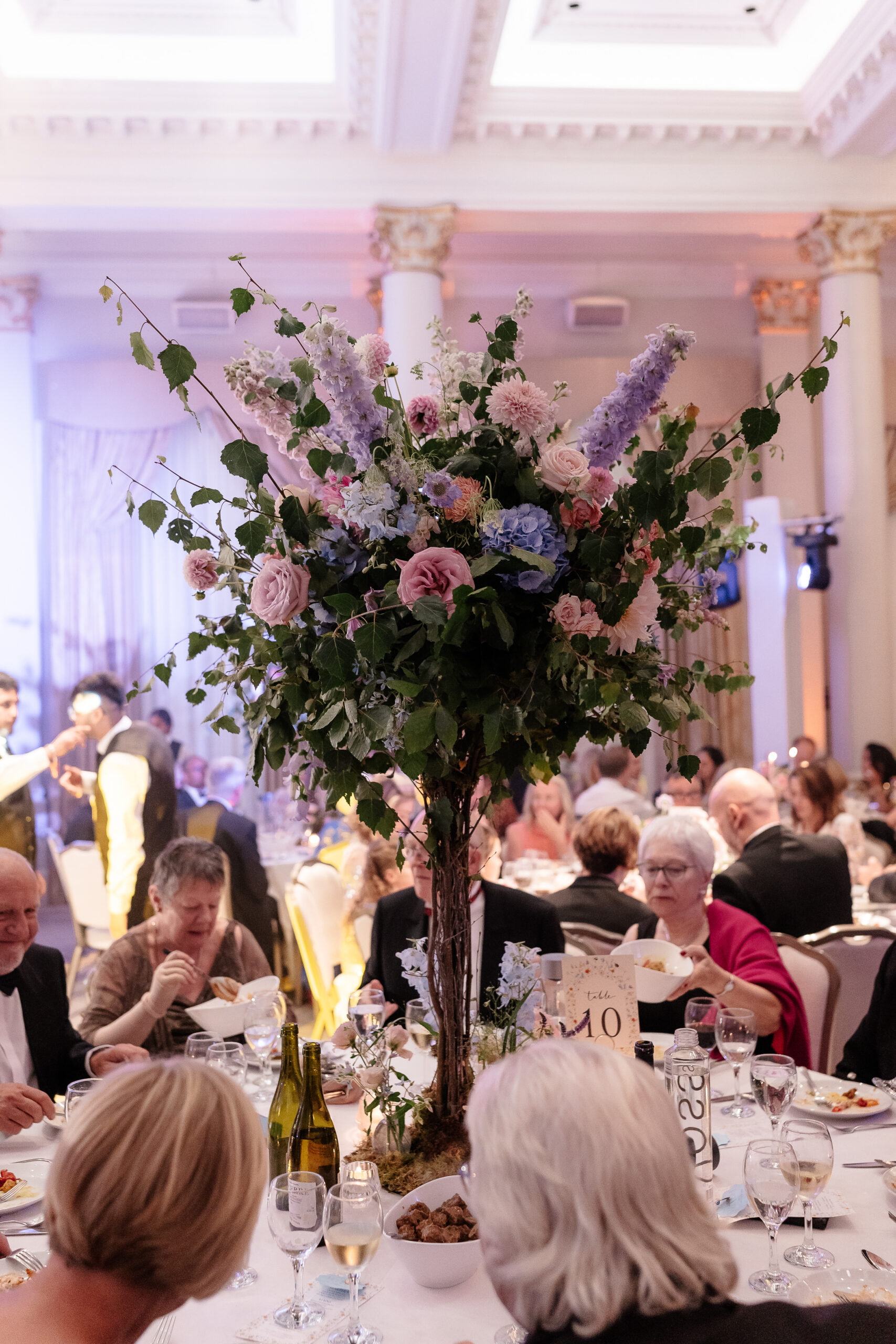 A formal event in a grand hall exudes Indian and British elegance, with ...