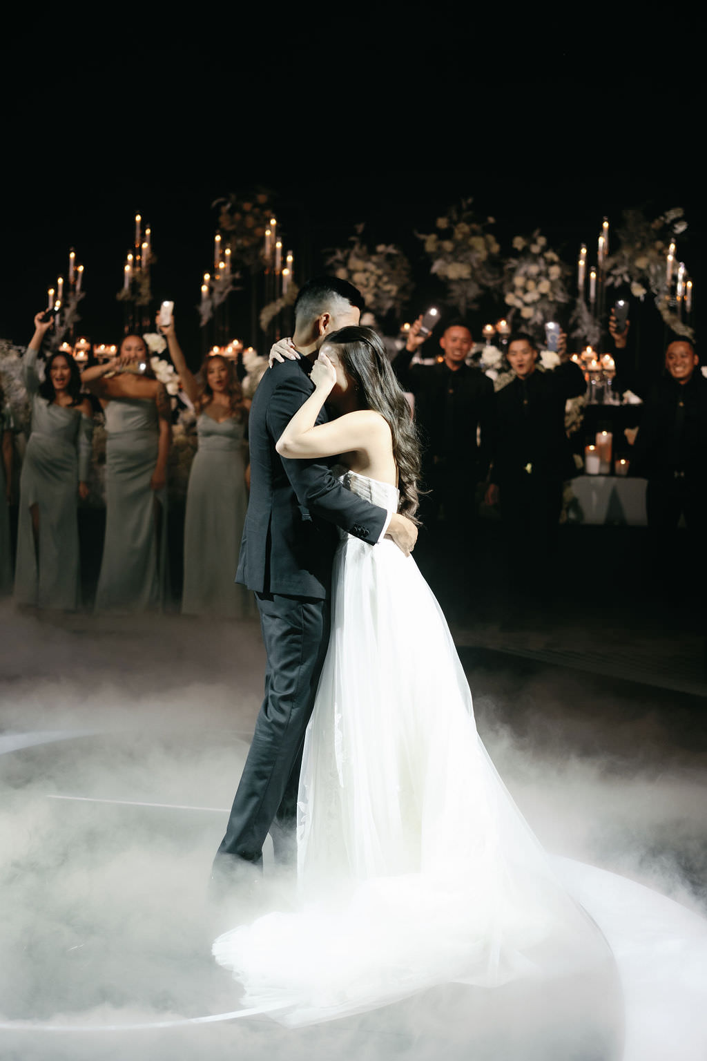 A bride and groom share a romantic first dance at their wedding ...