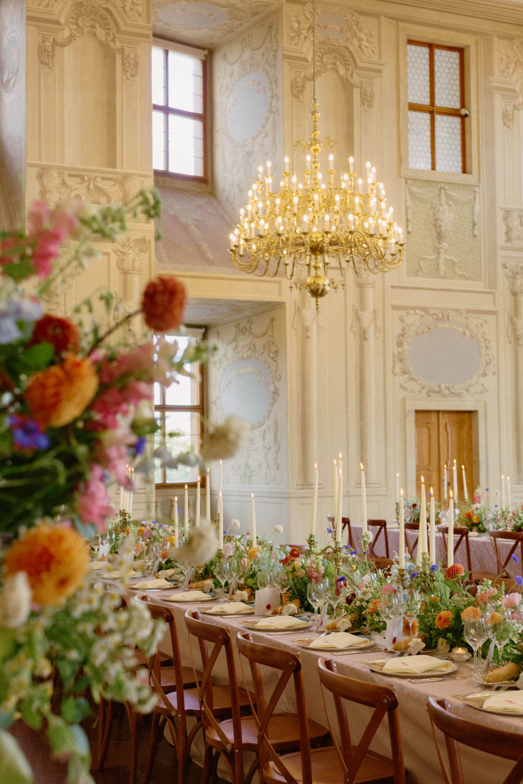 Elegant banquet hall with ornate cream-colored walls, a grand ...