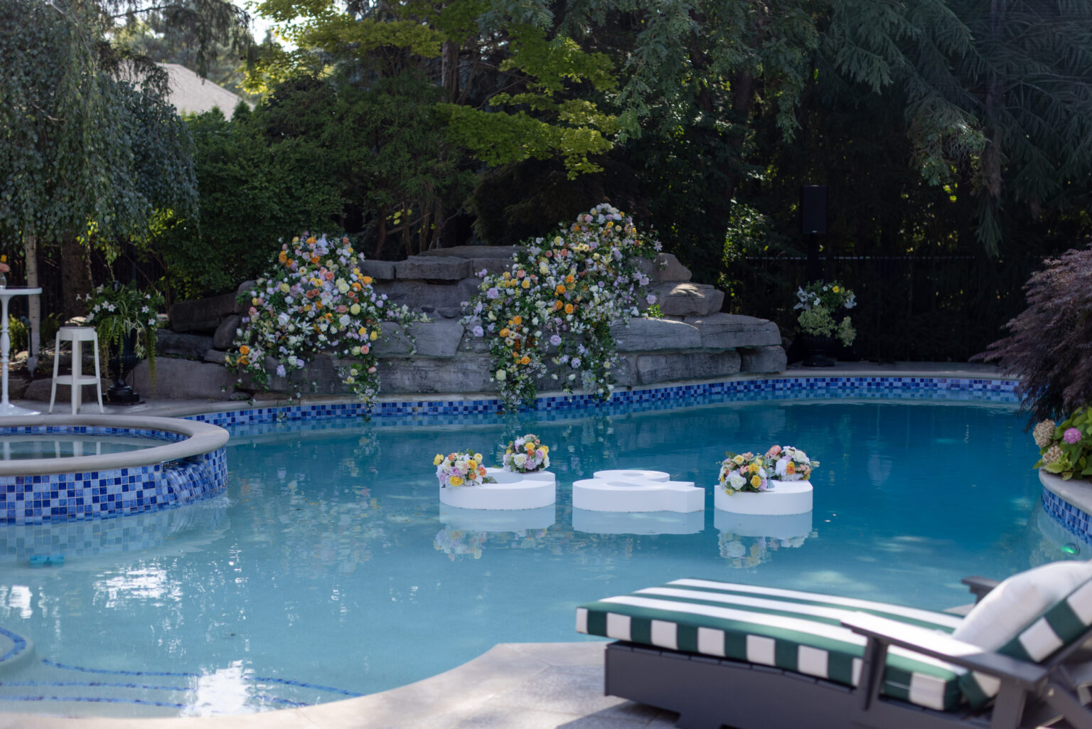 A swimming pool with a waterfall backdrop sets the scene for an Italian ...