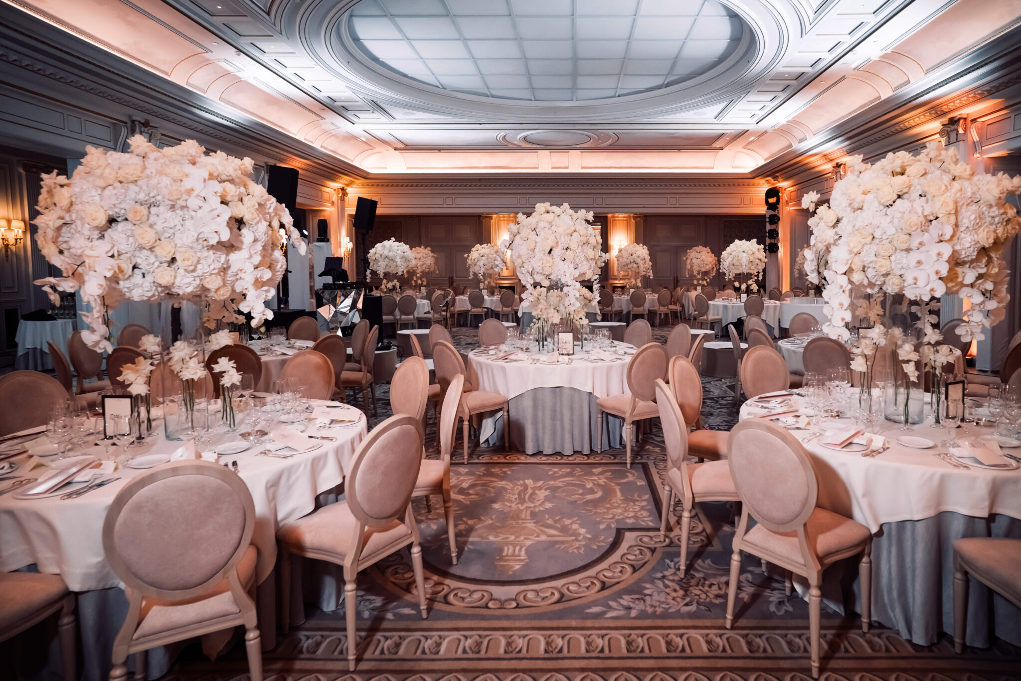 Elegant banquet hall set for a luxury Paris wedding, featuring round ...